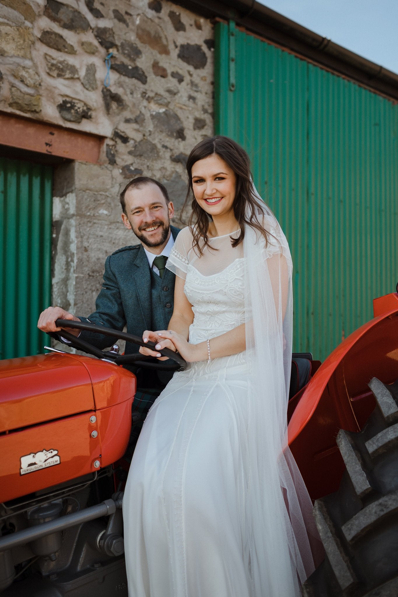 Glorious barn wedding surrounded by tractors, baby farm yard animals a ...